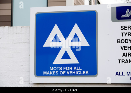 MOT / MOTs sign / logo at a garage which is also a Ministry of ...