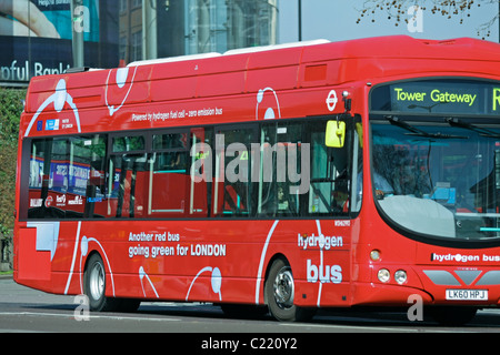A red London single decker Hydrogen powered bus traveling on its route ...