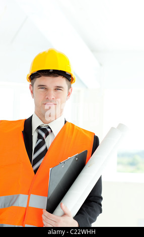 Portrait of a charismatic male architect holding blueprints Stock Photo ...
