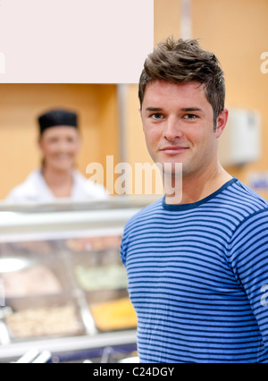 Woman choosing sauce in the store Stock Photo - Alamy