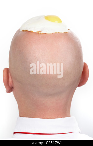 Bald man with fried eggs on top of head looking at camera Stock Photo ...