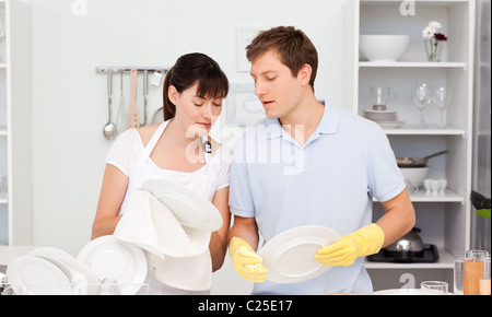 Lovers washing dishes together Stock Photo - Alamy