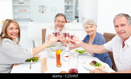 Retired friends toasting together Stock Photo - Alamy