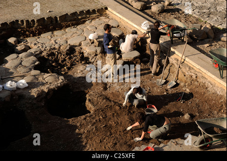 Archaeological excavations, archaeologists work, dig up an ancient clay ...