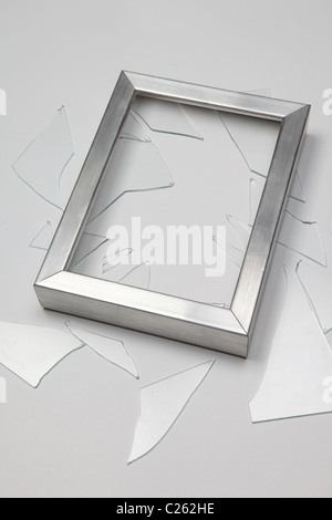 Empty silver coloured picture frame, broken with shattered glass Stock ...