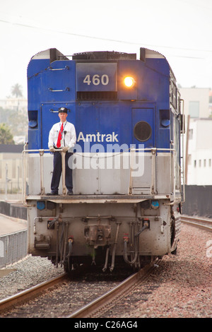 Amtrak railroad conductor assisting passenger at Deland Fl America USA ...