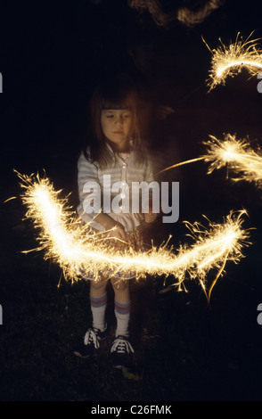 Girl playing with sparklers during Guy Fawkes Stock Photo - Alamy
