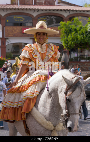 Mexican girl on horseback riding through Puerto Vallarta, Jalisco ...