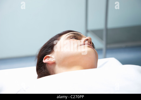 Female patient lying on an operating table Stock Photo - Alamy