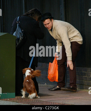 X Factor' contestant Olly Murs pets a dog on his way back to the 'X ...