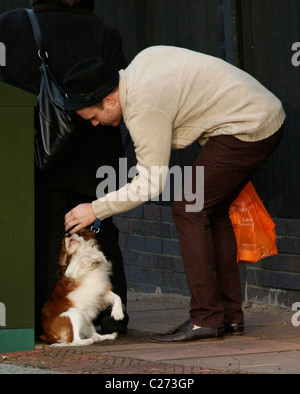 X Factor' contestant Olly Murs pets a dog on his way back to the 'X ...