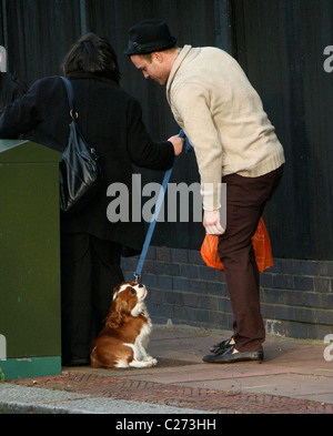 X Factor' contestant Olly Murs pets a dog on his way back to the 'X ...