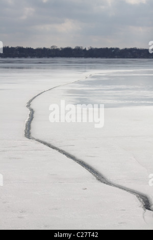 A split in a frozen lake Stock Photo - Alamy