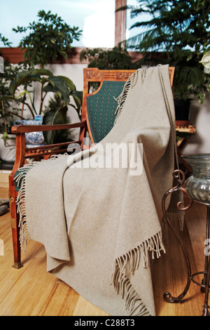 Throw draped over a chair Stock Photo: 18941856 - Alamy
