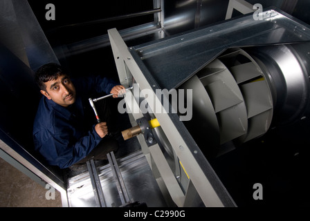 Engineer working on electric motor Stock Photo - Alamy