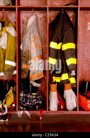 Fireman's gear and equipment hanging in lockers in a fire house Stock ...