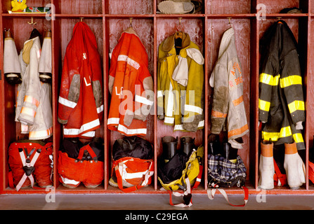 Fireman's gear and equipment hanging in lockers in a fire house Stock ...