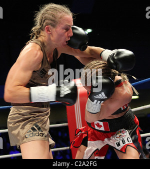 WBC Super-featherweight champion Olivia Gerula (red shorts) from ...