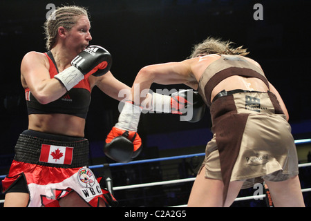 WBC Super-featherweight champion Olivia Gerula (red shorts) from ...