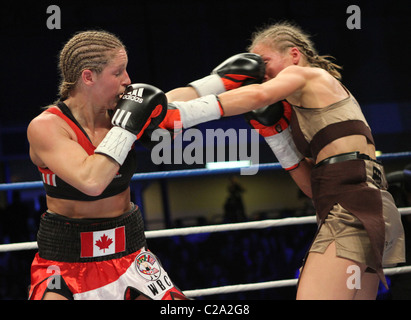 WBC Super-featherweight champion Olivia Gerula (red shorts) from ...