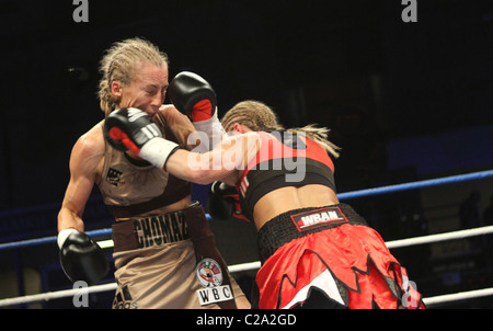 WBC Super-featherweight champion Olivia Gerula (red shorts) from ...