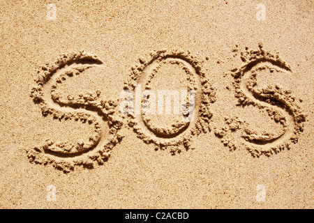 S.O.S written in the sand with a finger or stick Stock Photo - Alamy