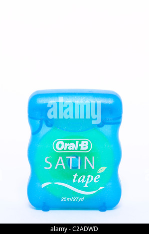 Dental floss tape closeup on plain background Stock Photo - Alamy