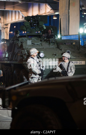An Army Stryker vehicle and humvee are set up for use at Combat in the ...