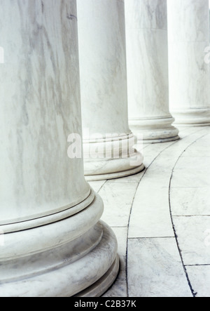 White marble pillars in a row. Row of marble columns. Stone columns ...