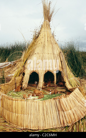 Straw houses on the floating islands of Uros in Lake Titicaca, Peru ...