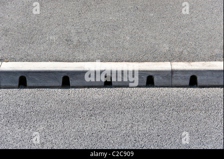 Sustainable urban drainage system (SUDS). Roadside drainage system in a ...