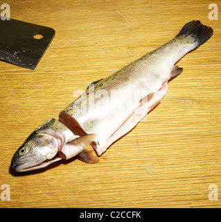 Rainbow trout on wooden table. Selective focus Stock Photo - Alamy
