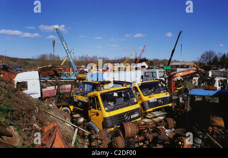lorries and scrapmetal in scrapyard uk Stock Photo - Alamy