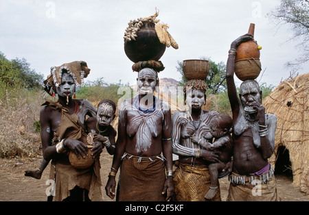 Mursi People Children in National Costumes in the Tribe Village Stock ...