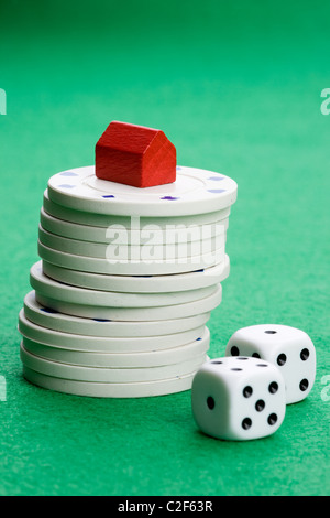 Casino chips with toy house - housing market gamble concept Stock Photo ...