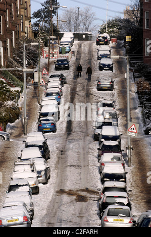 A steep street in Glasgow, Scotland which is covered in ice and snow ...