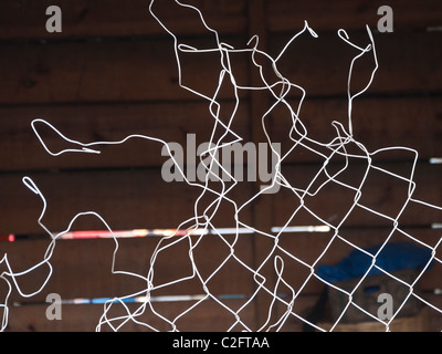 Graphic pattern created by a distorted chain link fence in the public ...