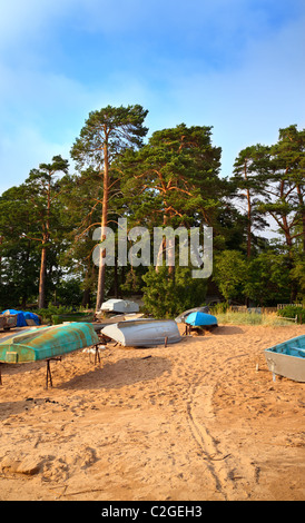 desolate beach with old boat at summer day Stock Photo - Alamy