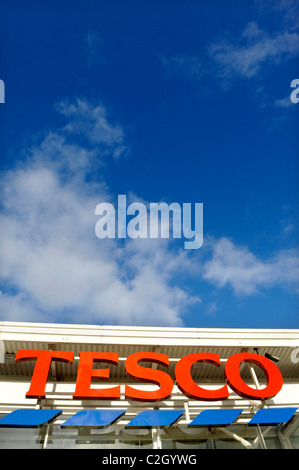 A generic Tesco supermarket sign against a blue sky Stock Photo - Alamy