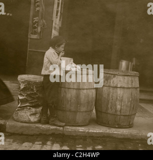 Patching Up a Meal from a Barrel Boston Slums Stock Photo - Alamy