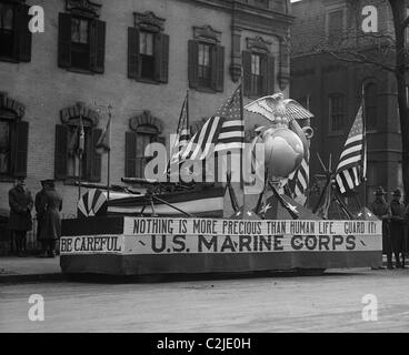 A US Marine Corps (USMC) Recruit armed with at 5.56mm M16A2 rifle, lies ...