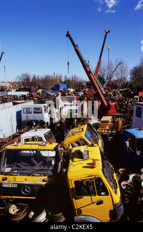 lorries and scrapmetal in scrapyard uk Stock Photo - Alamy
