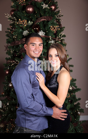 Young caucasian man wearing christmas hat holding credit card over ...