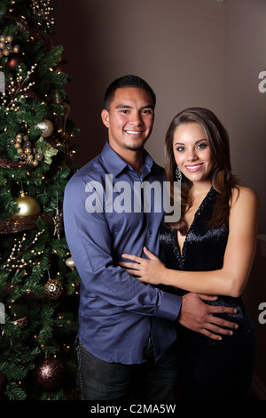 Young hispanic man wearing christmas hat making selfie by the ...