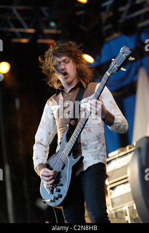 Michael Shuman from Queens of the Stone Age performing live in concert ...