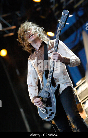 Michael Shuman from Queens of the Stone Age performing live in concert ...