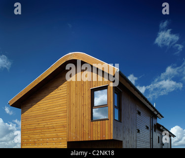 Horizontal timber cladding to gable end of building with tiled roof ...