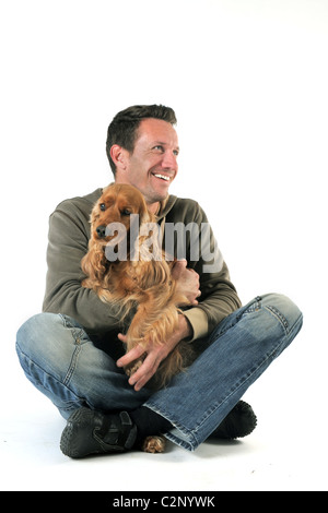 English Cocker Spaniel and owner in front of white background Stock ...
