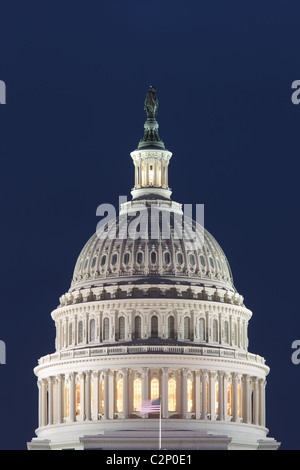 Lights illuminate the US Capitol Building at twilight in Washington, DC ...