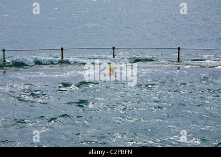 Swimmer in La Vallette bathing pool, Havelet Bay, St Peter Port ...